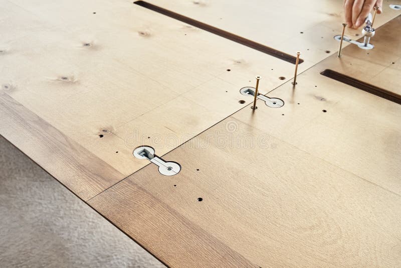 Craftsman Assembles Dining Table Turning Worktop Connector with Wrench ...