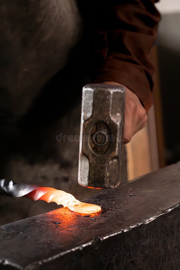 Craftsman - Blacksmith Manually Forging the Molten Metal with a Hammer ...