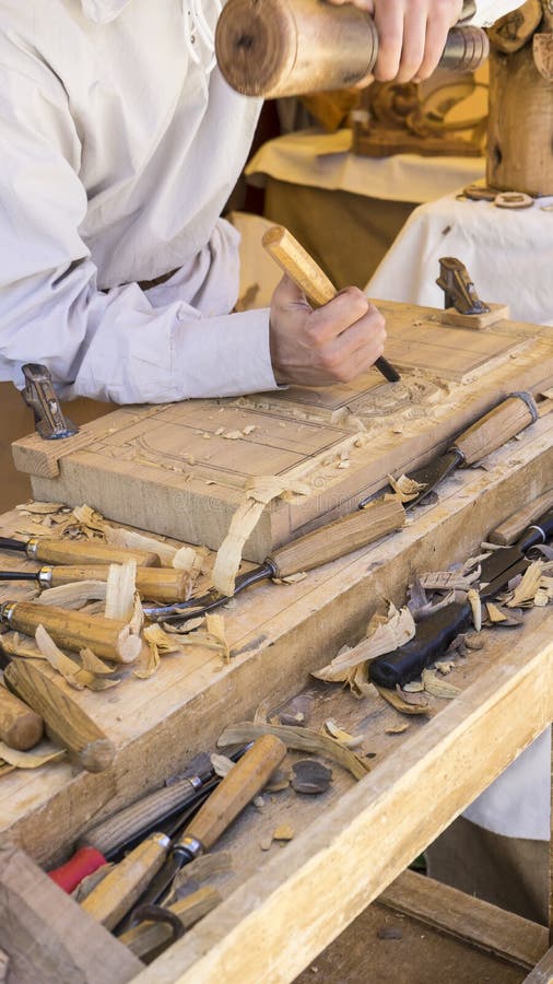 Craftsman Carving Wood in a Medieval Fair, Carpentry Tools Stock Image ...