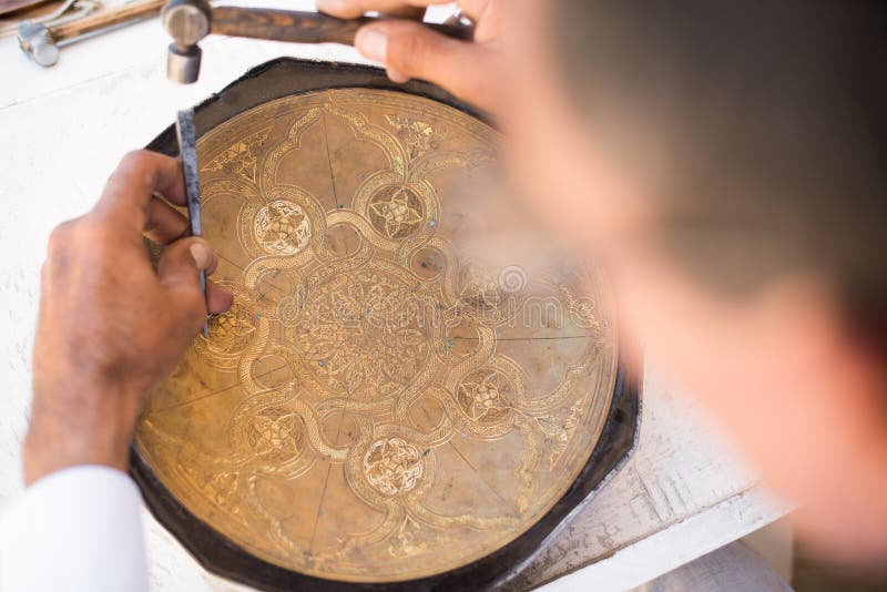 Chaser of copper at work stock photo. Image of bronze - 119235404