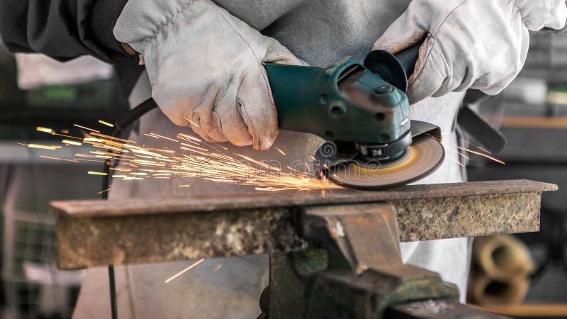 Craftsman Grinding Metal with Disk Grinder in Workshop. Worker Cleaning ...