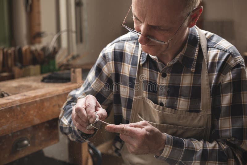 Craftsman Highly Focused Working Inside a Workshop Stock Photo - Image ...