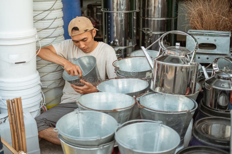 Craftsman Installing the Bucket Handle while Sitting Stock Image ...