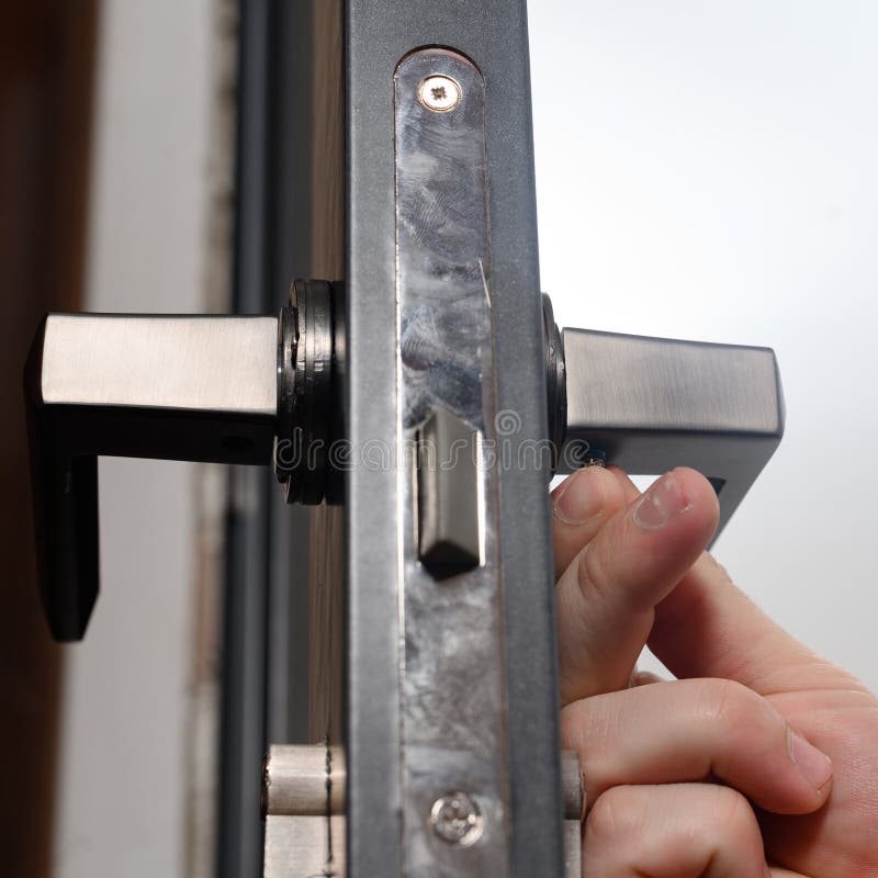 The Master Installs the Door Handle with the Help of a Sprocket Key ...