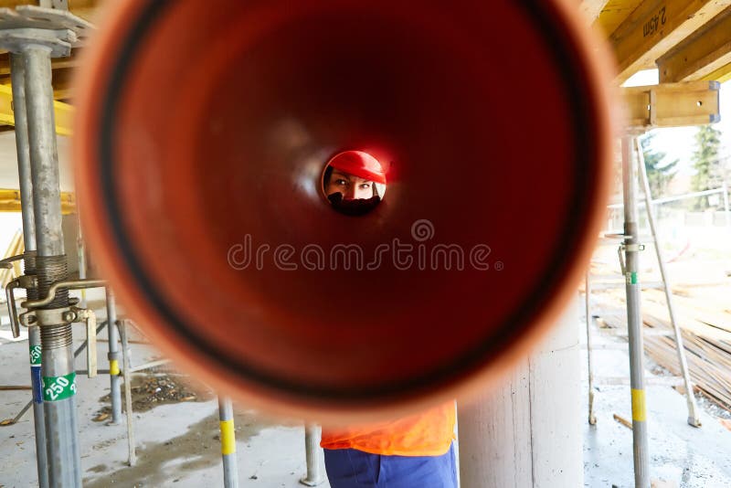 Craftsman Looks through a Drain Pipe in the Shell Stock Image - Image ...
