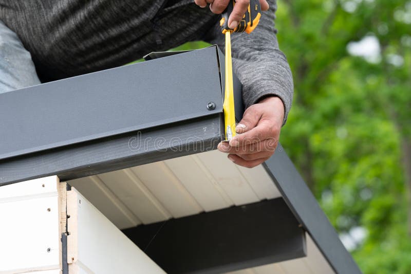 The Craftsman Measures the Length of the Metal Cladding at the Edge of ...
