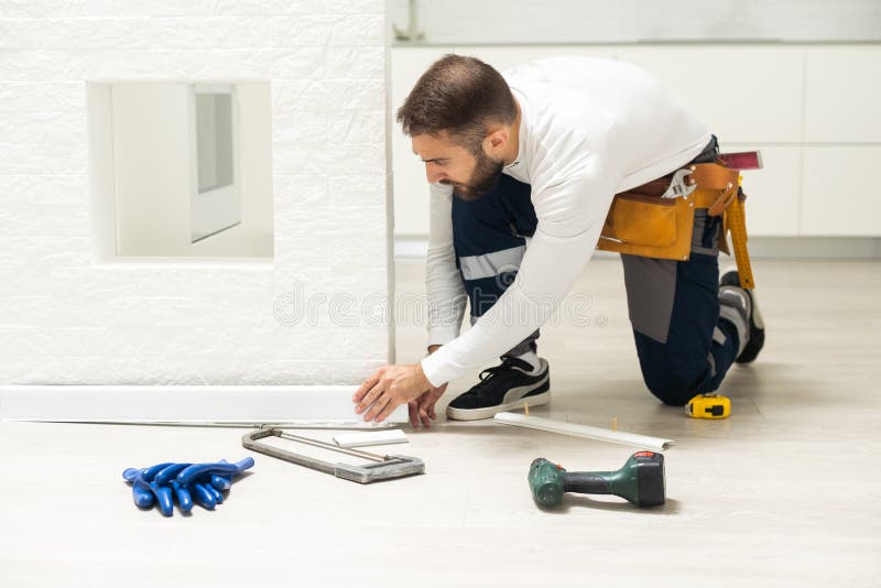 The Craftsman Measures the Length of the Plinth for Cutting, Installing ...