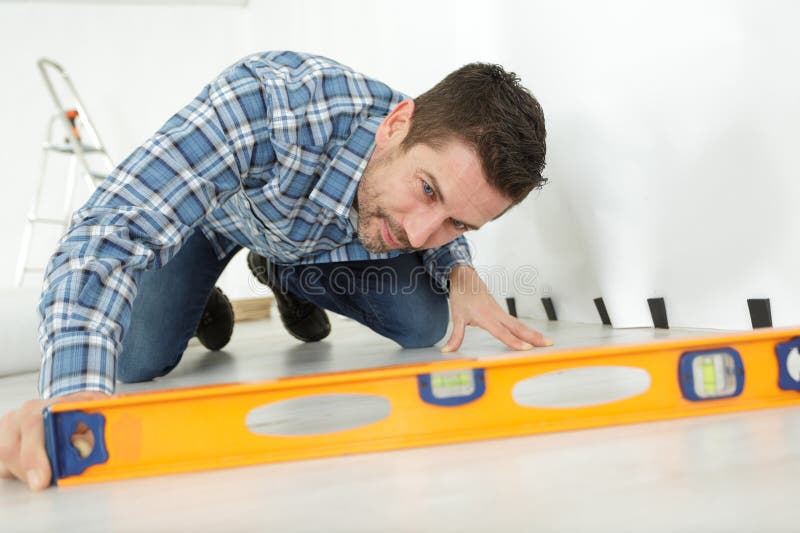 Craftsman Measuring Floor Level Stock Photo - Image of wooden, level ...