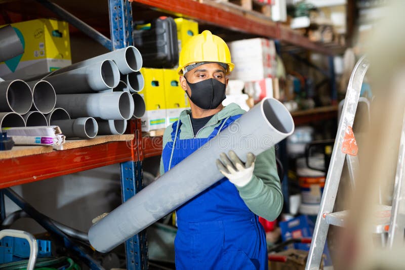 Craftsman in Protective Mask with Plumbing Pipe at Hardware Store Stock ...