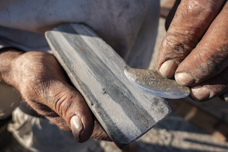 A Craftsman Sharpening a Knife Stock Image - Image of knife, grinding ...