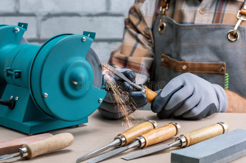 Craftsman Sharpening Work Tool on Grinder. Stock Photo - Image of ...