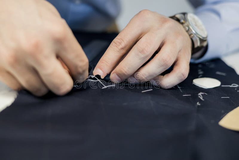 Craftsman tailor at work stock image. Image of atelier - 371637075