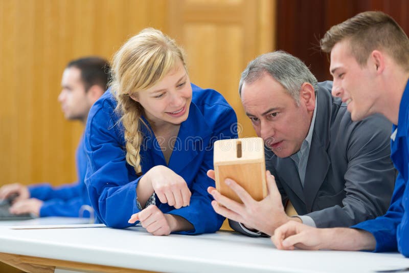 Craftsman Team Cooperating on Building Construction Planning Stock ...