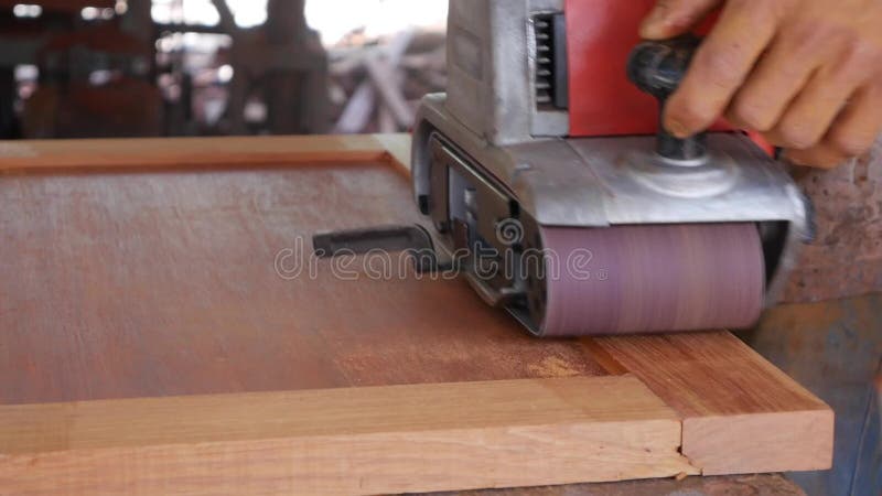 Craftsman Using Sander Machine while Carpentry Work in Workshop. Worker ...