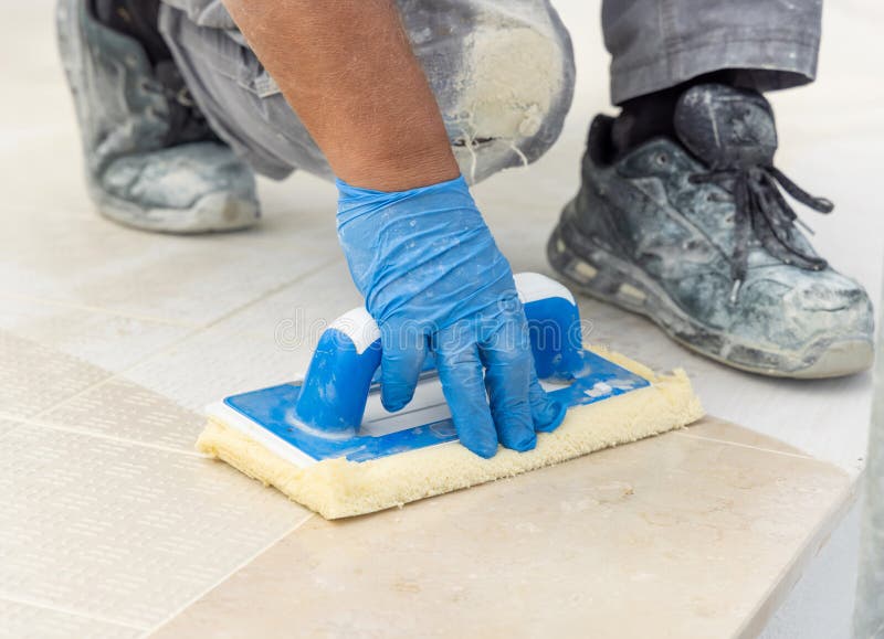 Craftsman in Grey Work Clothes Washing Surface with a Float during ...