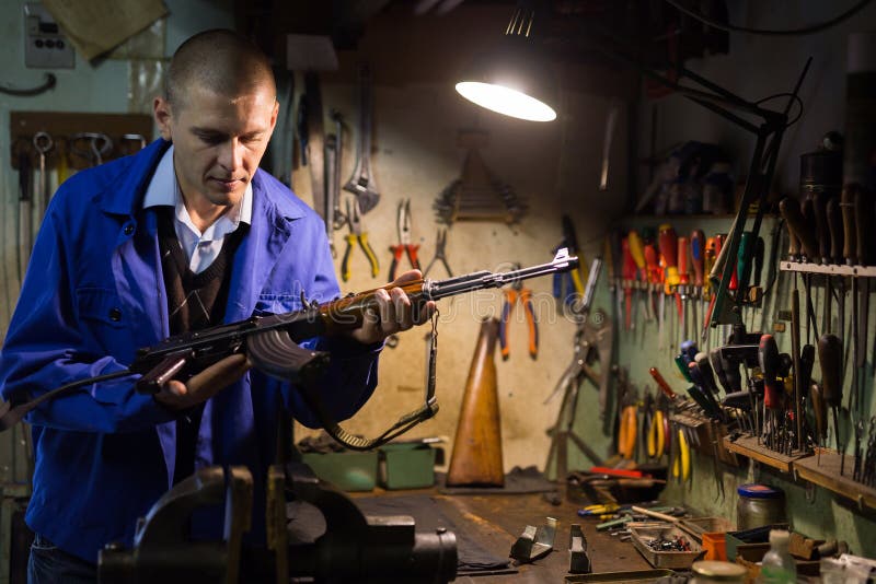 Craftsman of Weapons Workshop Inspecting Kalashnikov Assault Rifle ...