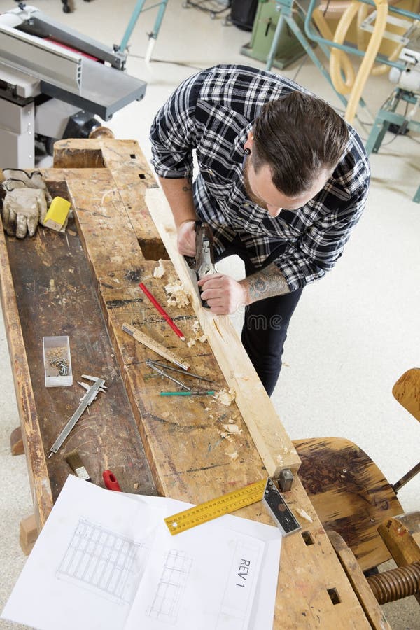 Craftsman Work with Plane on Wood Plank in Workshop Stock Photo - Image ...