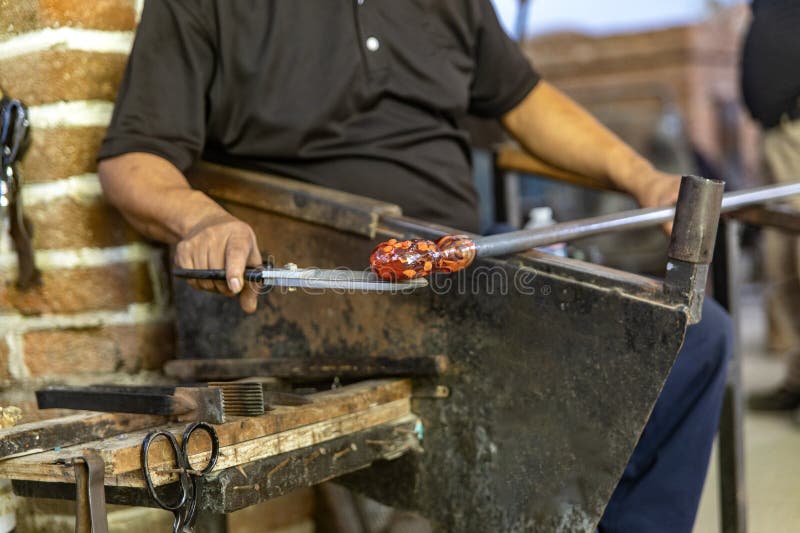 Craftsman Working, Cutting and Molding the Glass with the Traditional ...