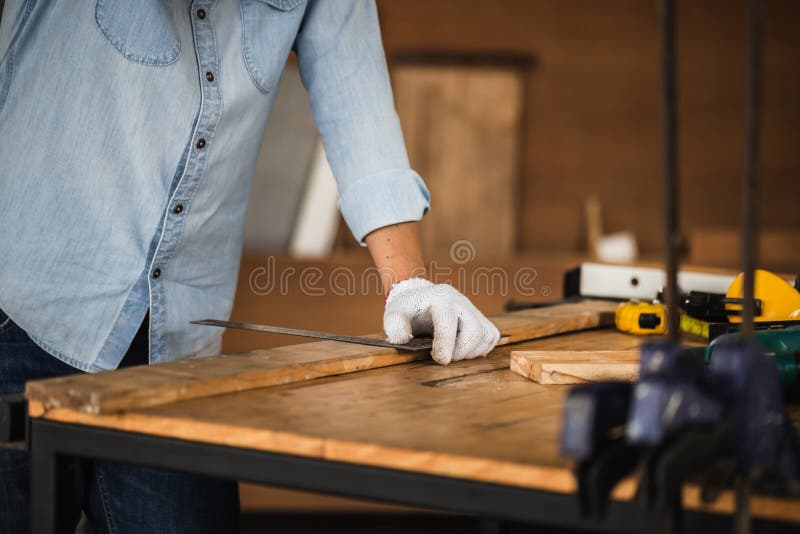 Craftsman Works on Workbench, Carpenter Working on Woodworking Machines ...