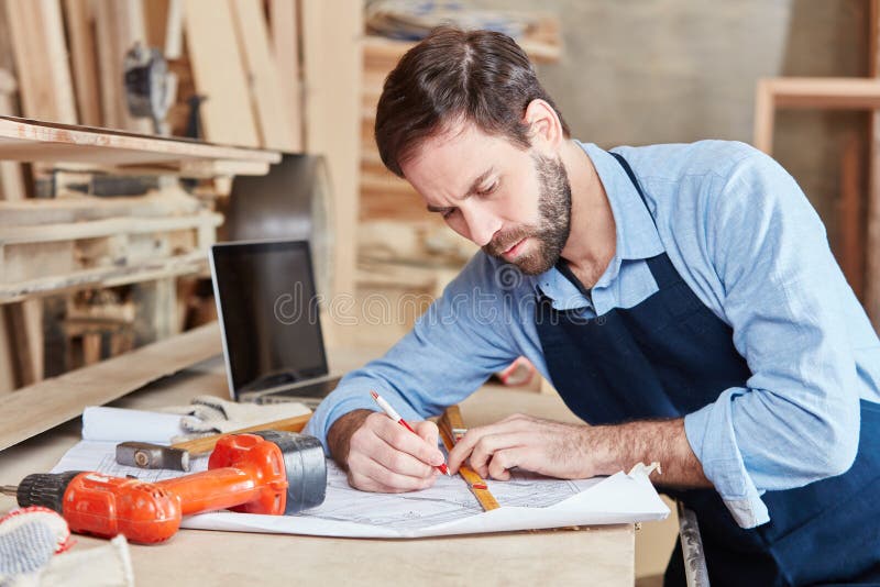Craftsman in Workshop Draws Plan Stock Image - Image of plan, planning ...