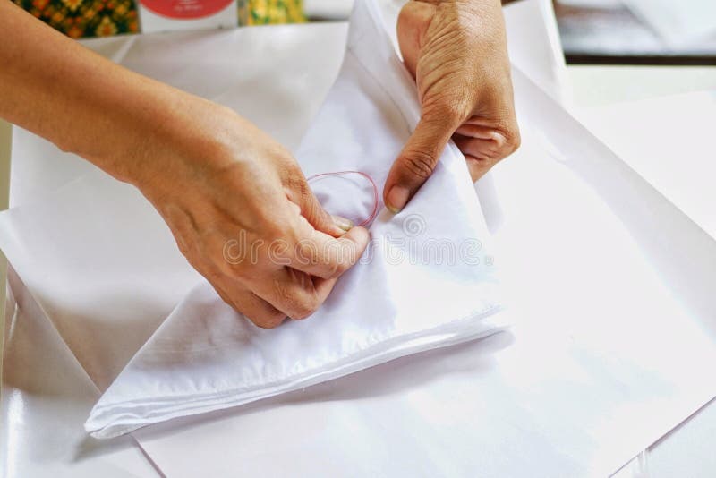 Craftsmanship of Sewing the Cloth by Using Needle and Thread Stock ...