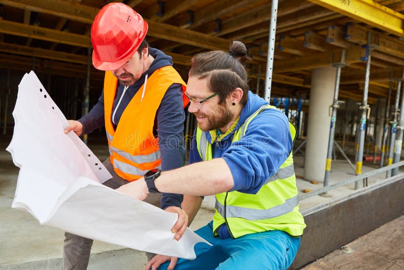 Craftsman and Construction Worker with Architectural Drawing Stock ...