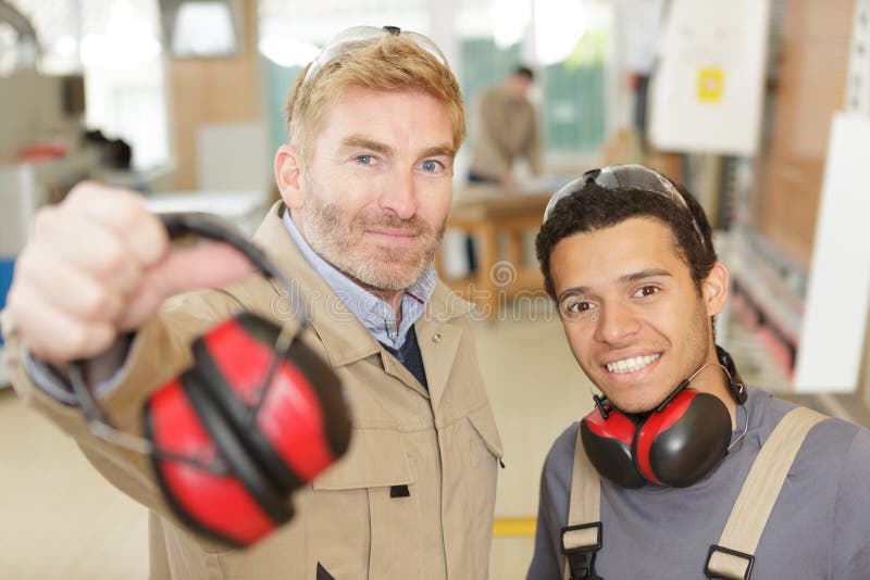 Craftsmen with Labor Protection and Ear Protection Stock Image - Image ...