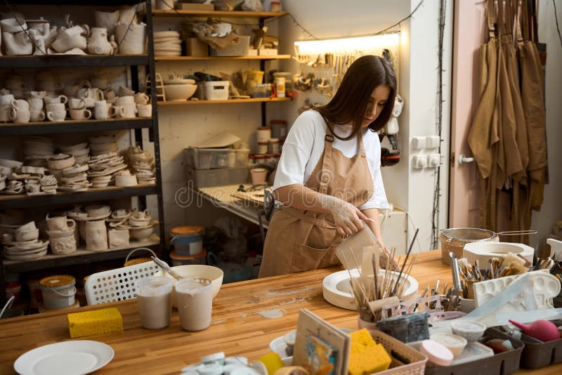 Craftswoman Pouring Gypsum into the Silicone Mold in Workshop Stock ...