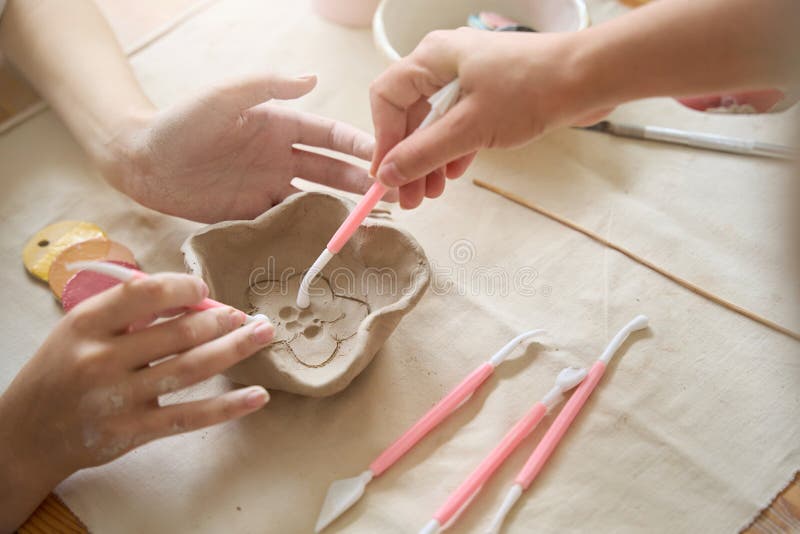 Craftswomen Apply a Pattern To a Clay Plate Stock Photo - Image of ...