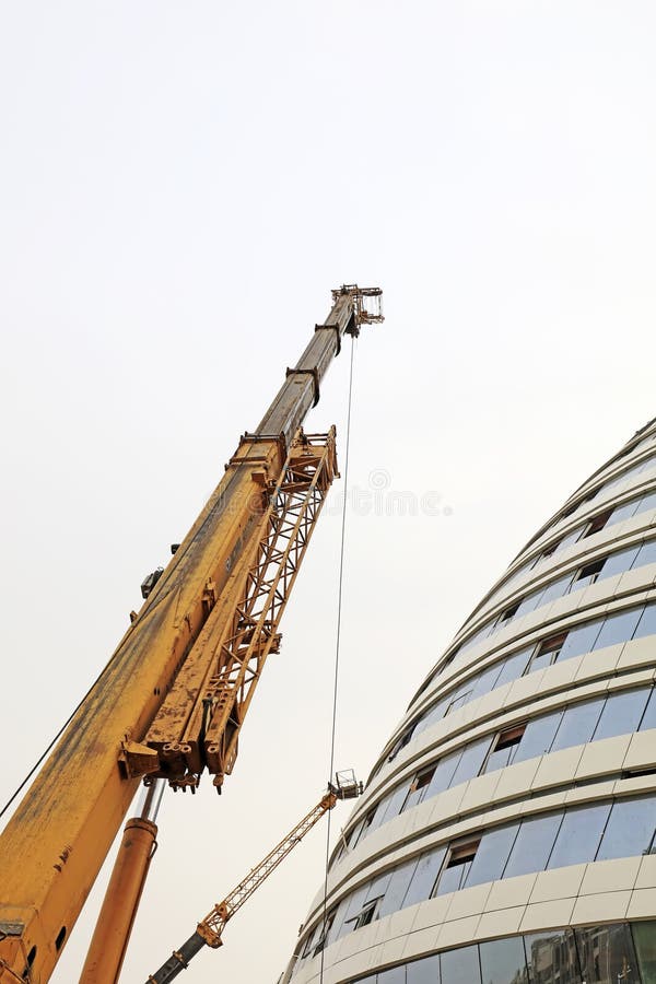 Crane Arm and Glass Curtain Wall Stock Photo - Image of decoration ...