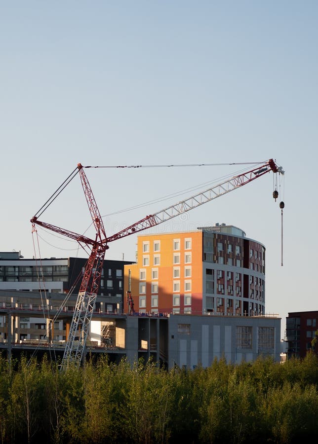 Crane and Building Construction. Construction Crane on Housing Stock ...