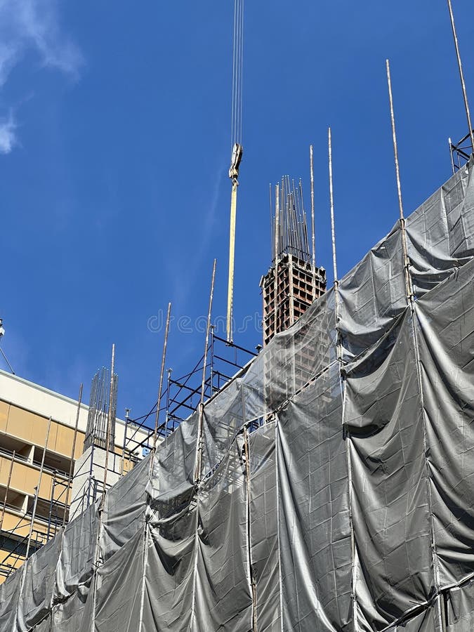 Crane and Building Construction Site Against Blue Sky Stock Image ...