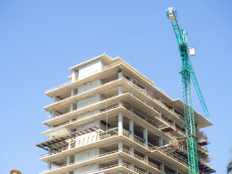 The Crane is Building a Tall Building. Building Frame. Construction ...