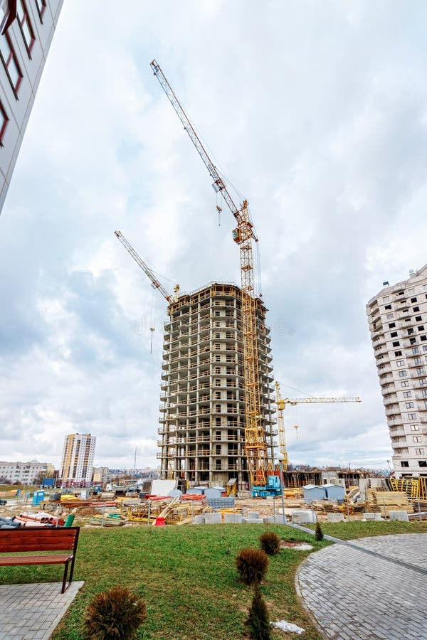 Crane and Building Under Construction Against Blue Sky Stock Photo ...
