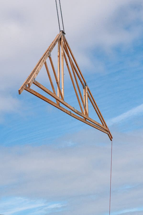 Crane Chains, Lifting and Moving Two Roof Trusses, into Position Stock ...