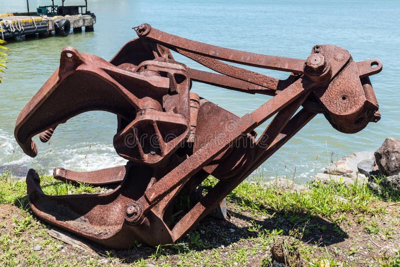 Crane Claw in a Seaport. Industrial Port Loading Equipment Stock Image ...