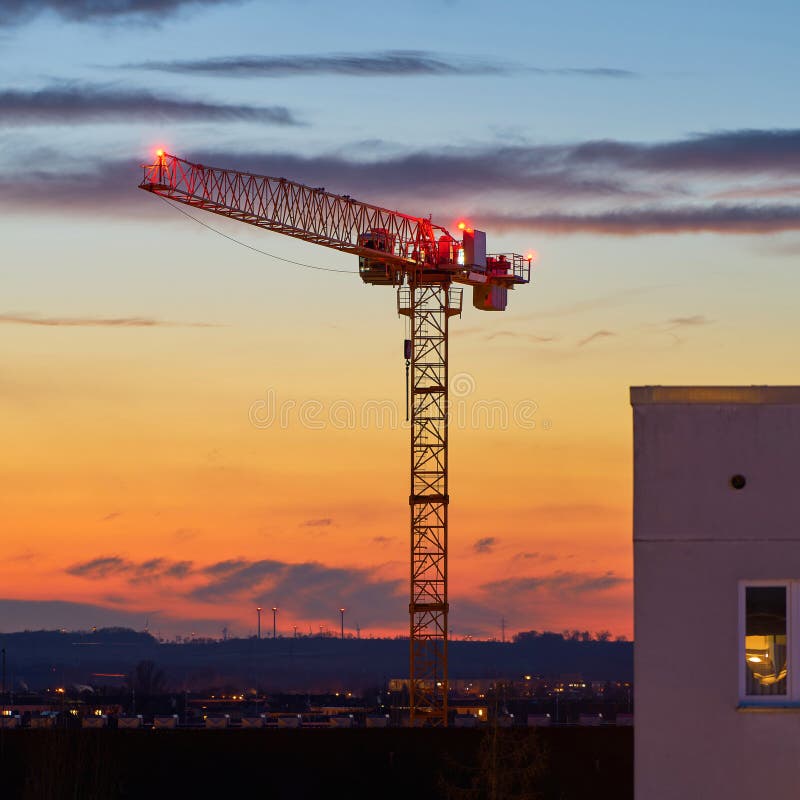 Crane on a Construction Site in the Evening at Sunset Stock Image ...