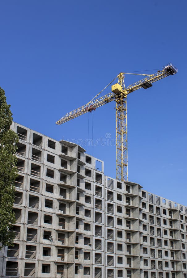 Crane and Construction Site. New Complex of Apartment Buildings Under ...