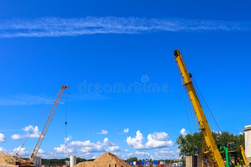 A Crane on a Construction Site with Construction Sand and Gravel, on a ...