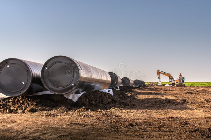 Crane Digging a Channel for Gas Pipeline Stock Photo - Image of site ...