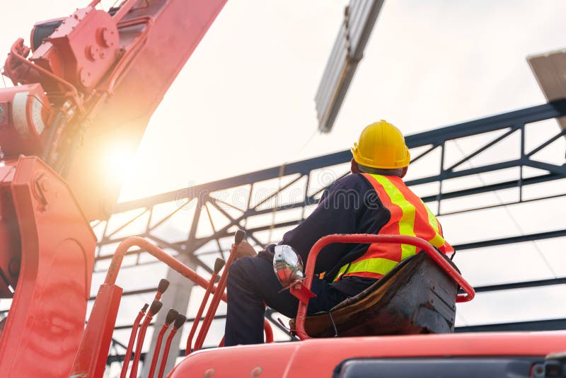 A Crane Driver is Working on the Construction Site Stock Image - Image ...