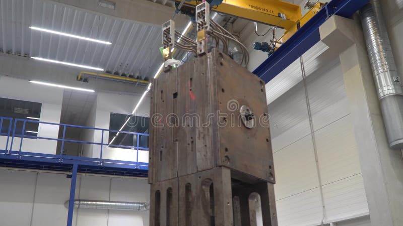 Crane in a Factory Relocating Heavy Metal Objects between Production ...