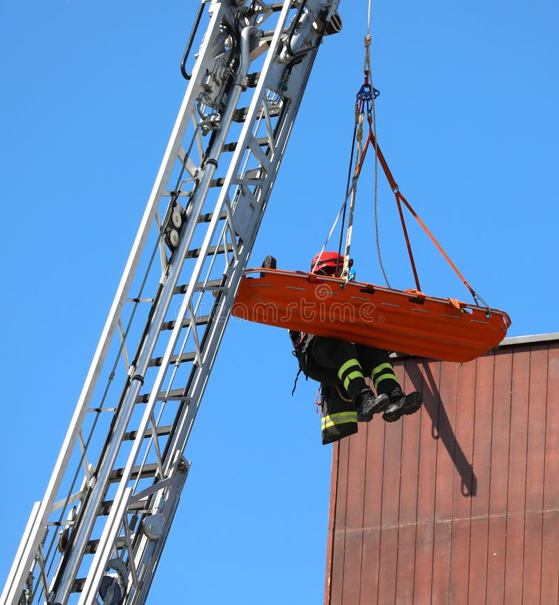 Crane and Firefighter during a Fire Drill Editorial Photography - Image ...