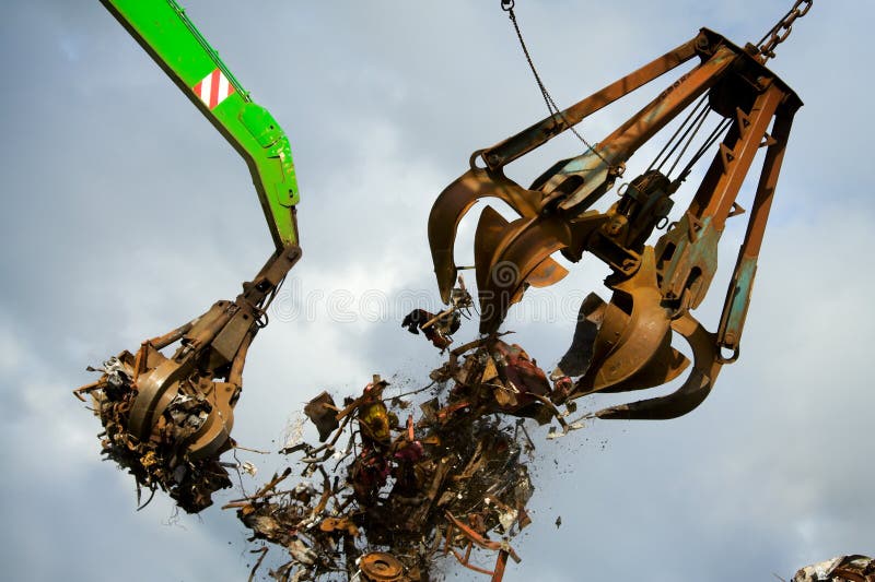 Crane Grabber Loading a Truck with Metal Scrap Stock Photo - Image of ...