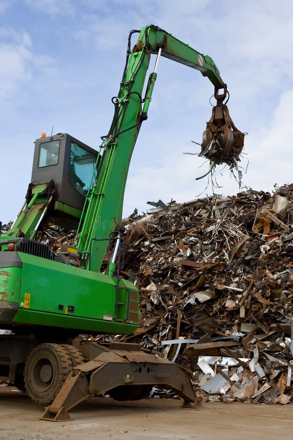 Crane Grabber Loading a Truck with Metal Scrap Stock Photo - Image of ...