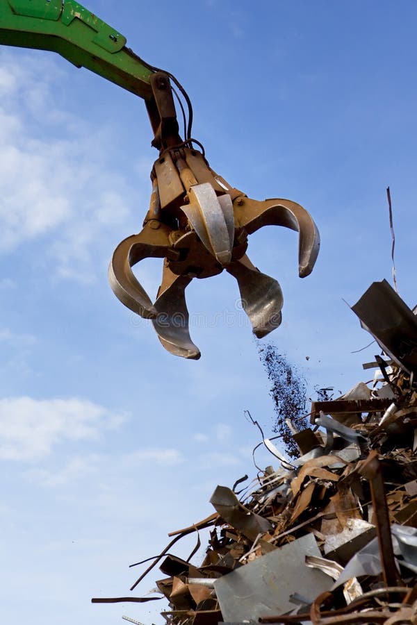 Crane Grabber Loading a Truck with Metal Scrap Stock Photo - Image of ...