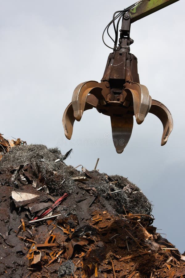 Crane Grabber Loading a Truck with Metal Scrap Stock Photo - Image of ...