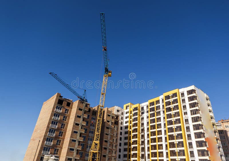 Crane and High Rise Building Under Construction Against Blue Sky Stock ...
