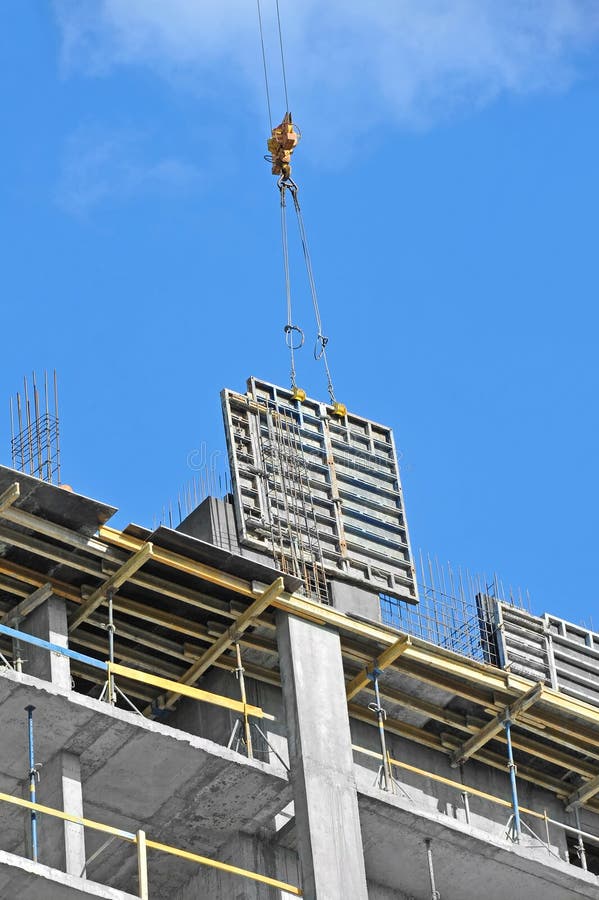 Crane hoisting formwork stock image. Image of construction - 53802925
