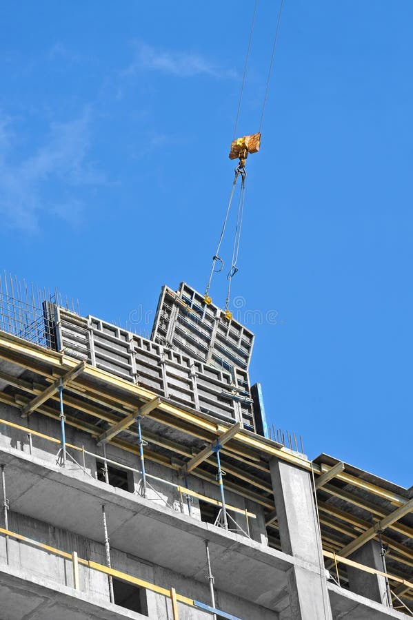 Crane hoisting formwork stock photo. Image of curb, formwork - 53952022